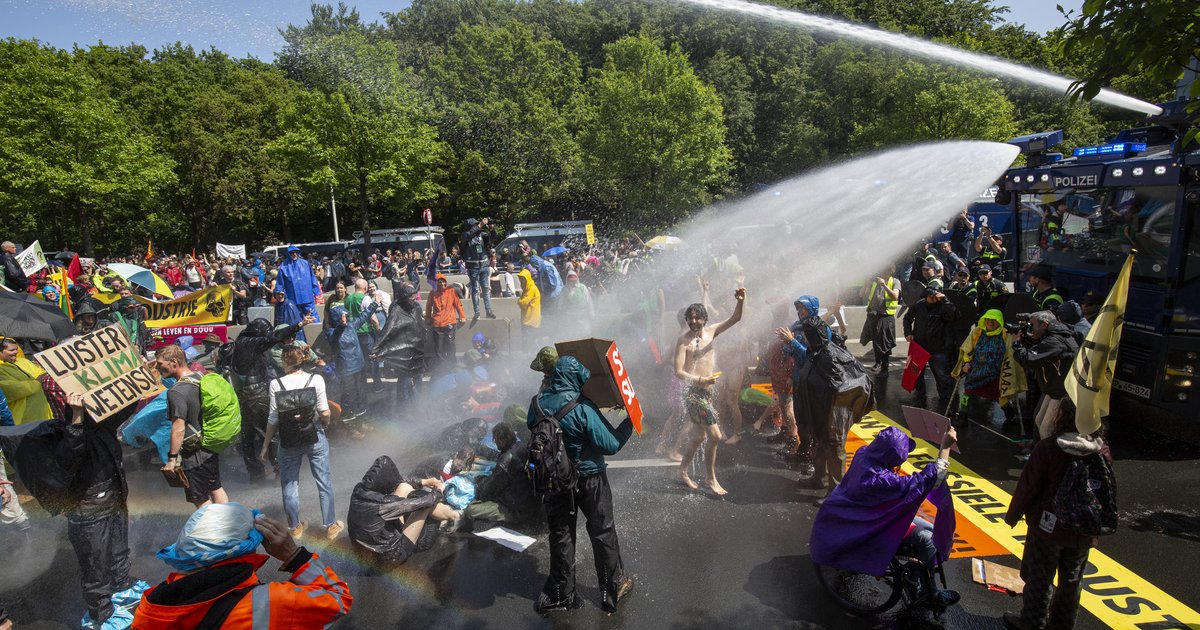 Police use water cannons on climate activists; new report reveals ...